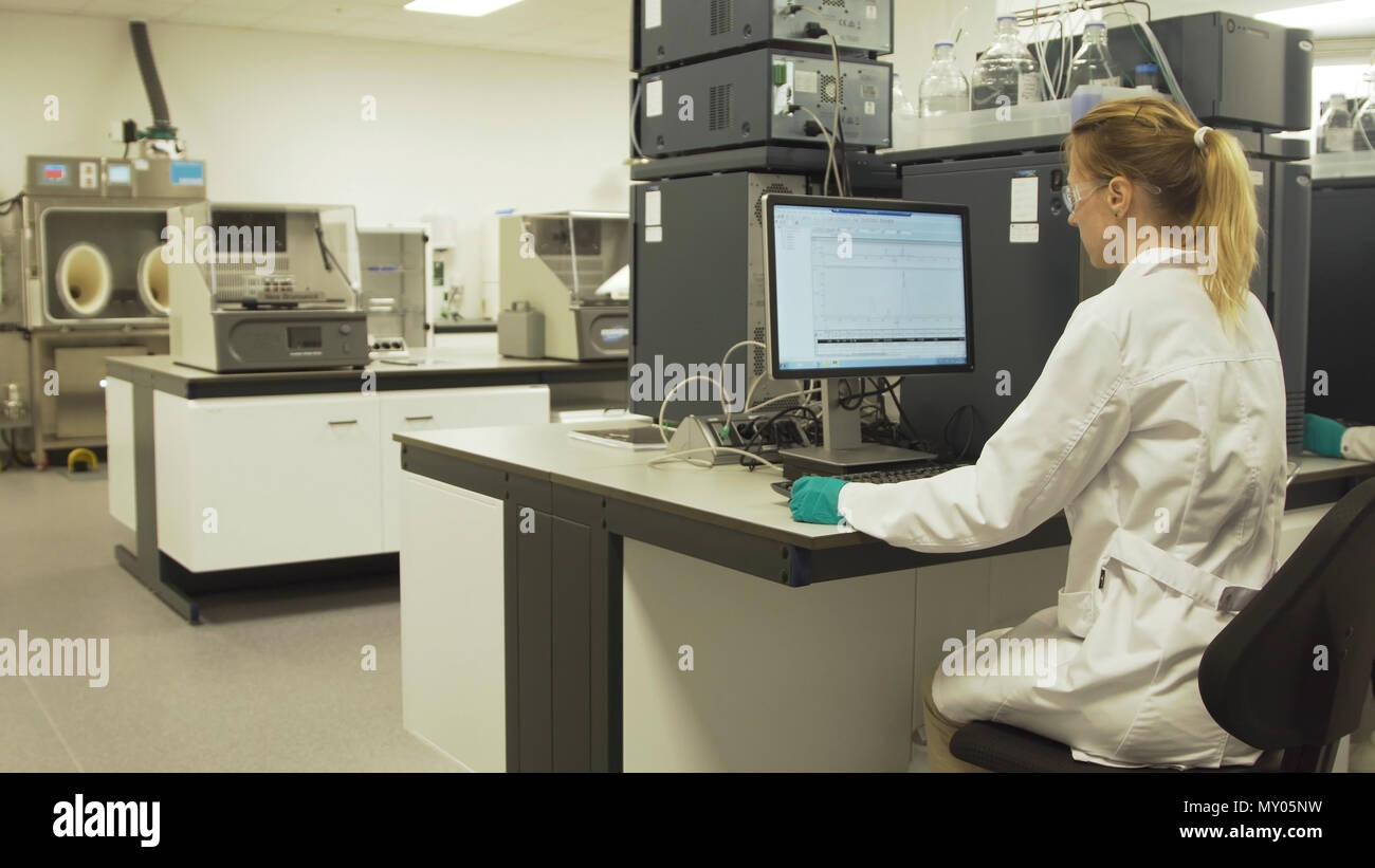 Scientists in the laboratory in front of computers do scientific ...