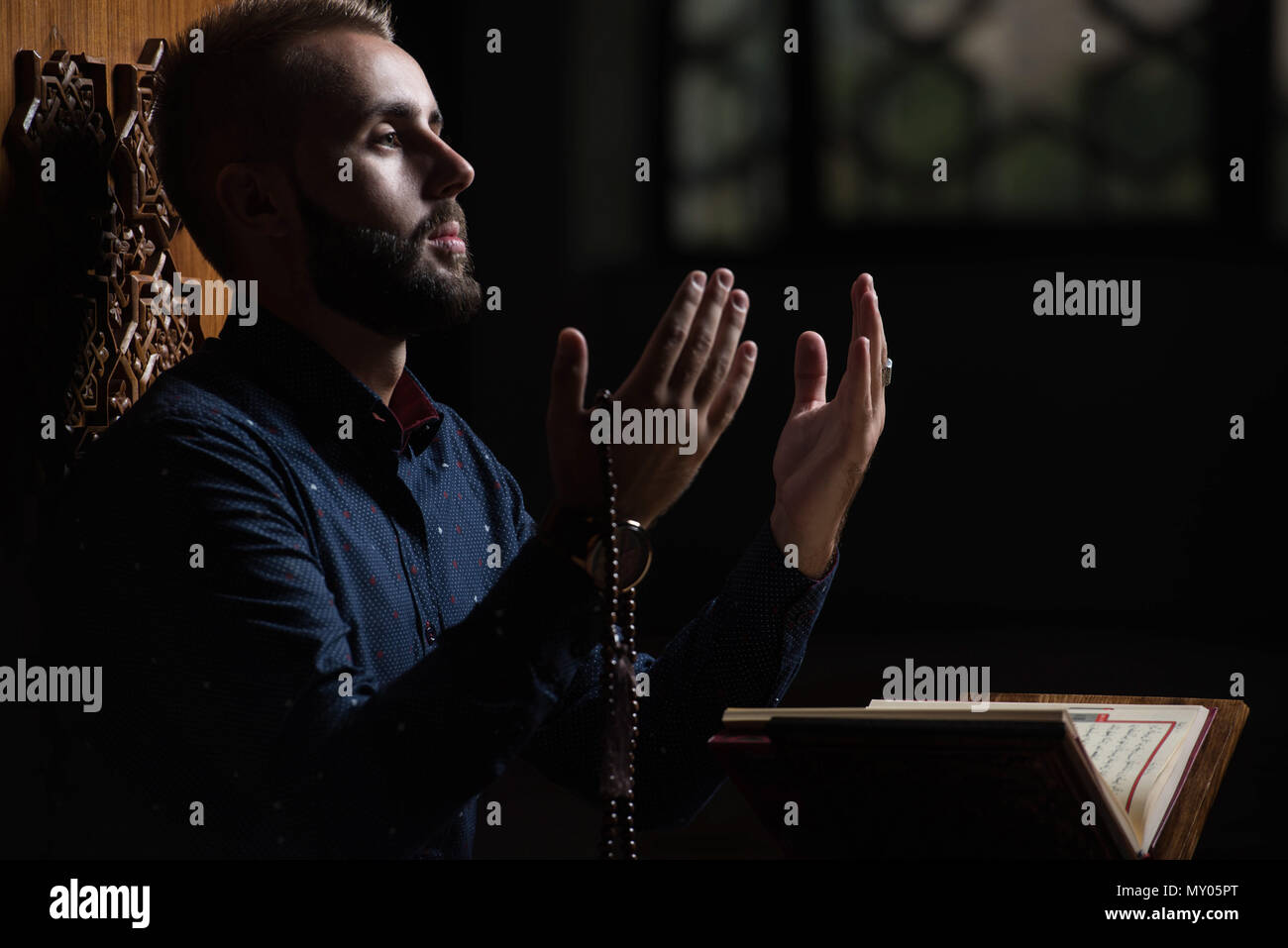 Humble muslim man reading koran hi-res stock photography and images - Alamy