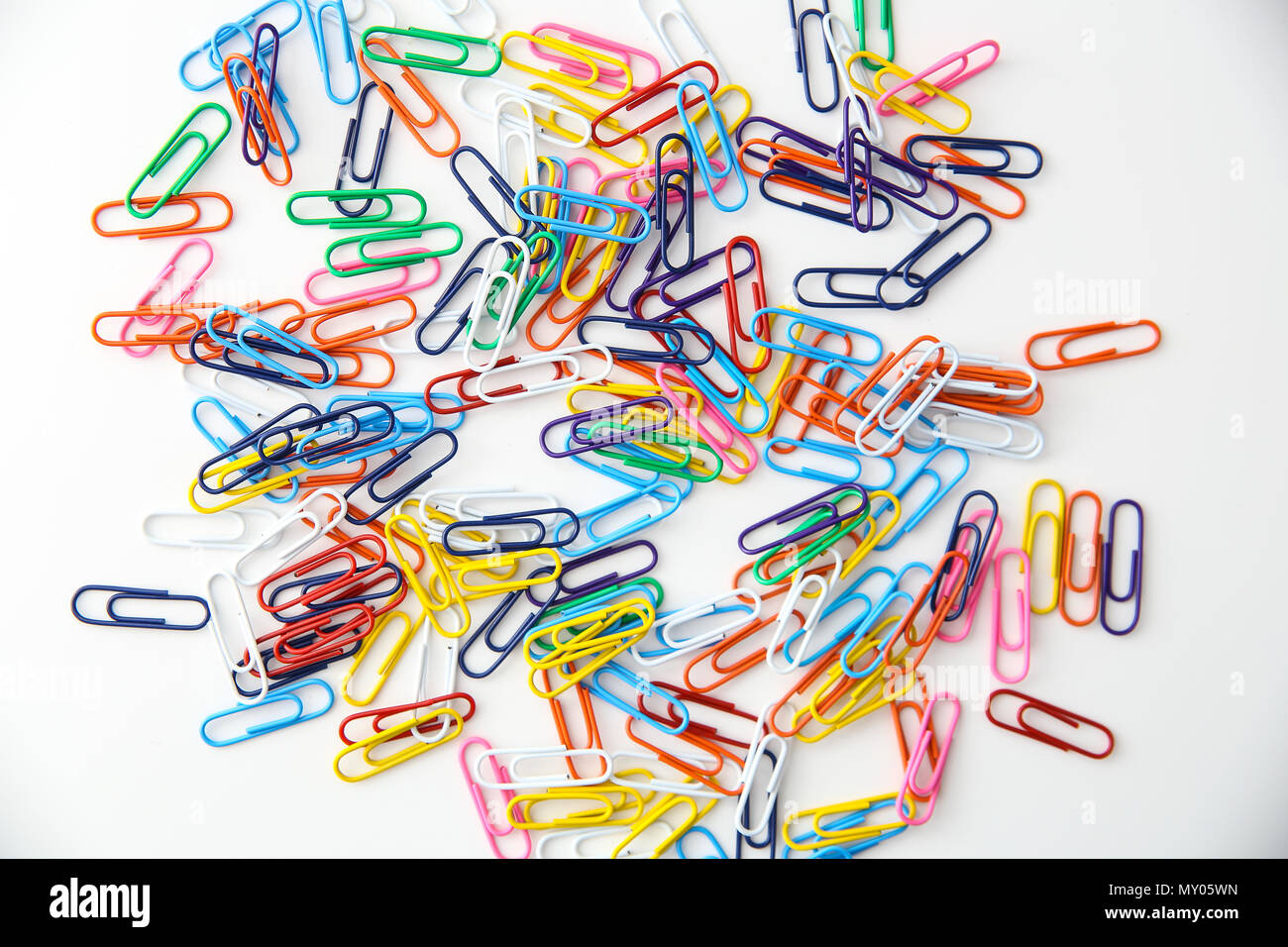 A set of color paper clips in a white background Stock Photo - Alamy