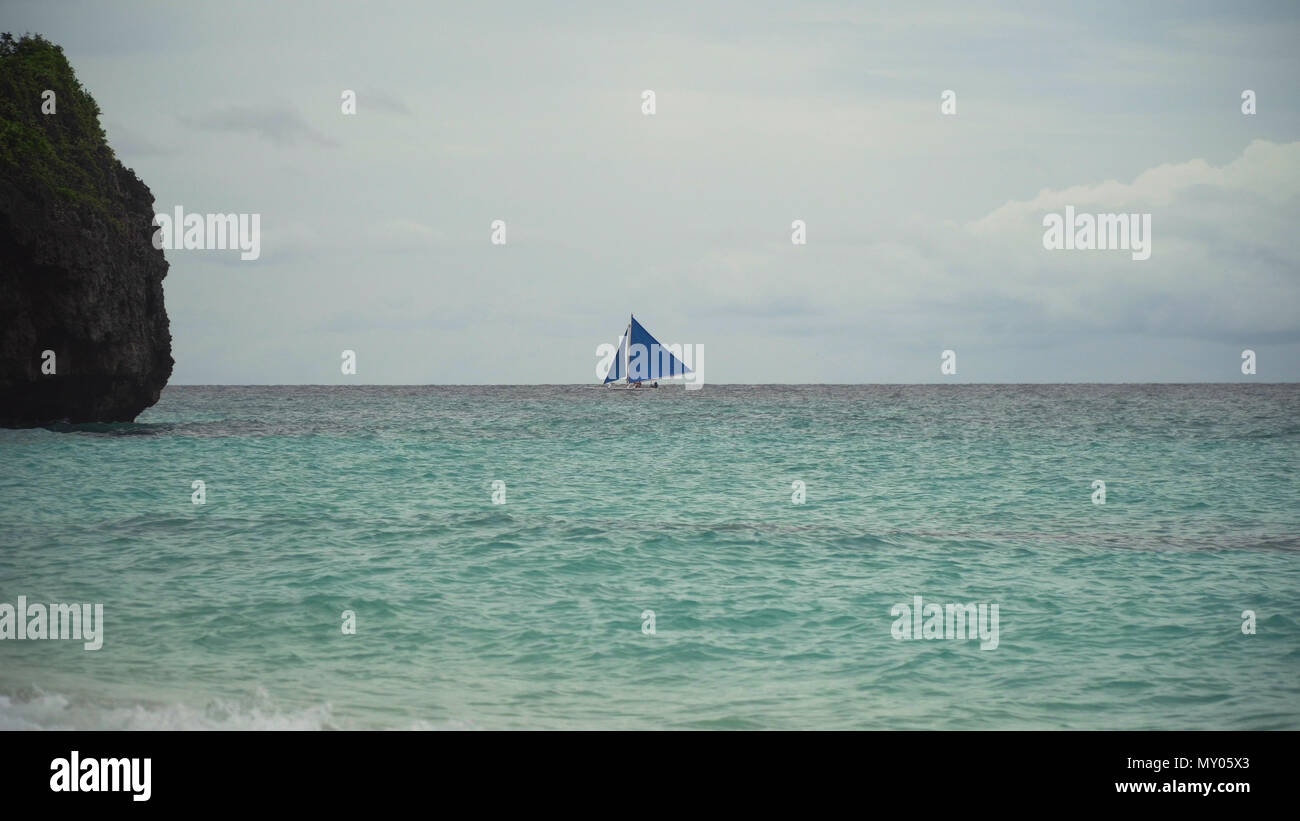 Sailing boat on sea. Sailing ship yachts with blue sails in the ocean ...