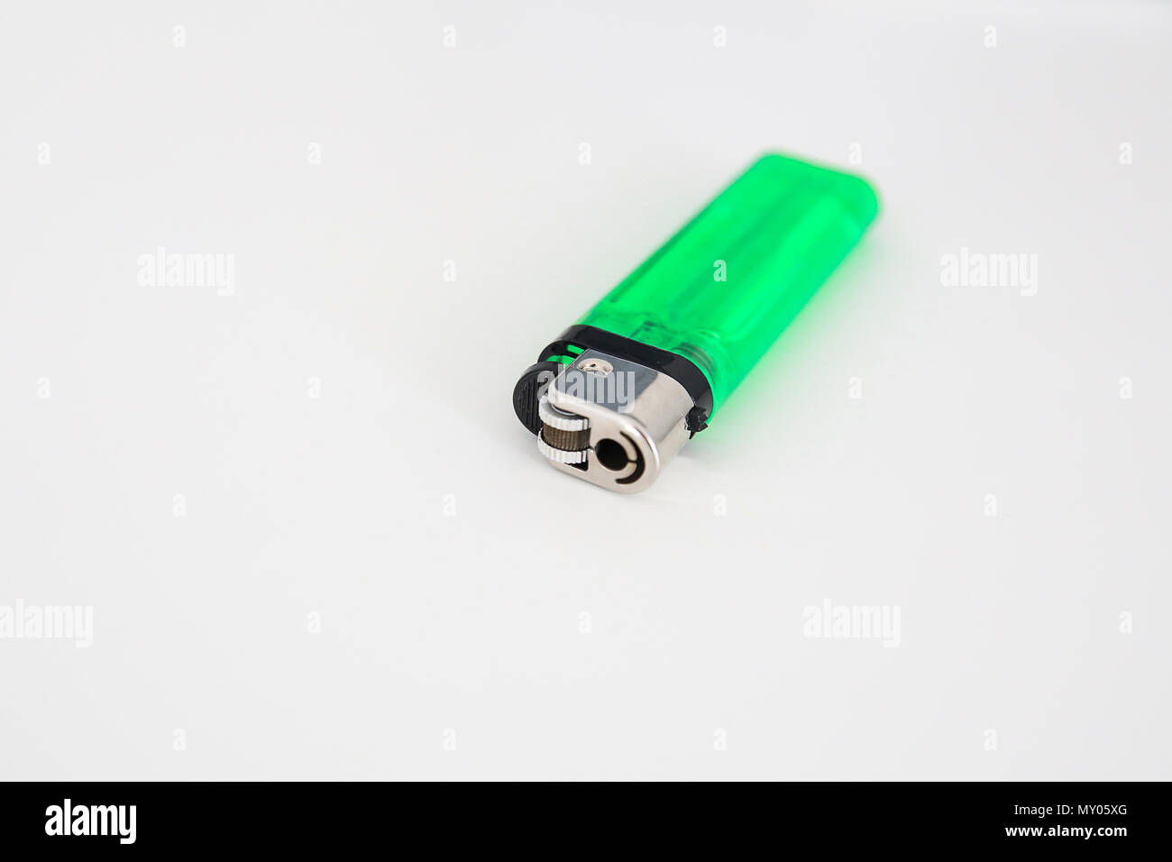Green lighter on a modern office desk Stock Photo - Alamy