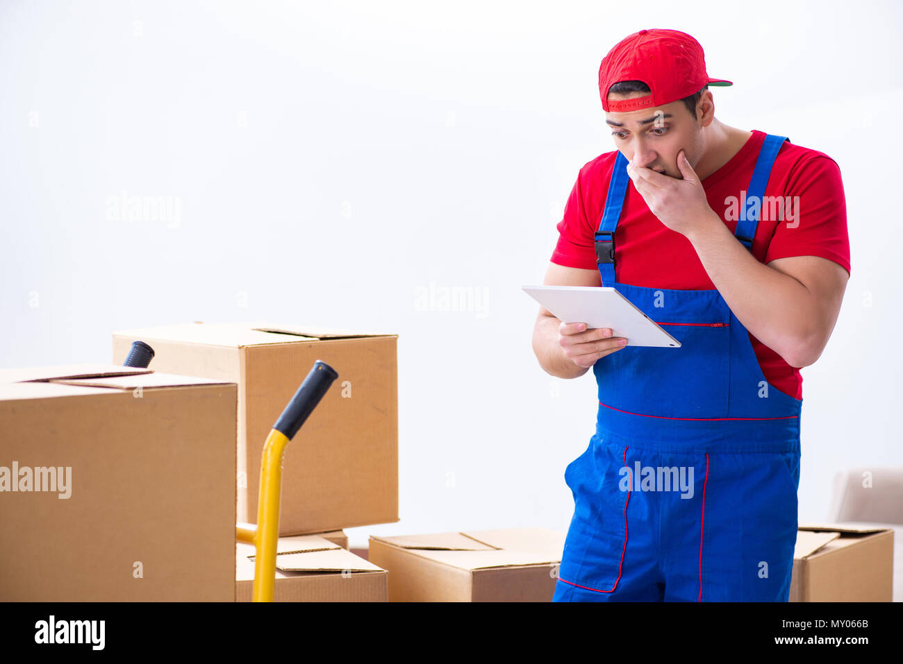 Contractor worker moving boxes during office move Stock Photo - Alamy
