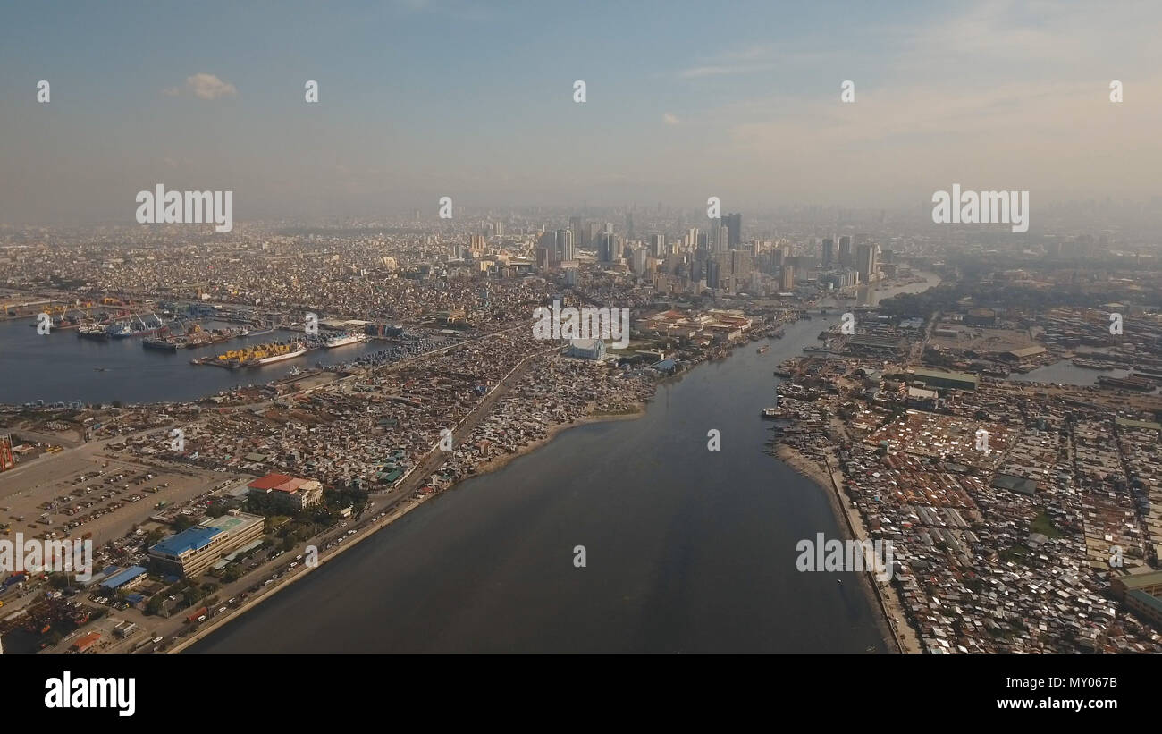 Aerial view skyline of Manila city. Fly over city with skyscrapers and ...