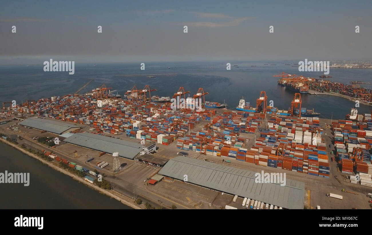Aerial view industrial cargo port with ships and cranes, Manila. View ...