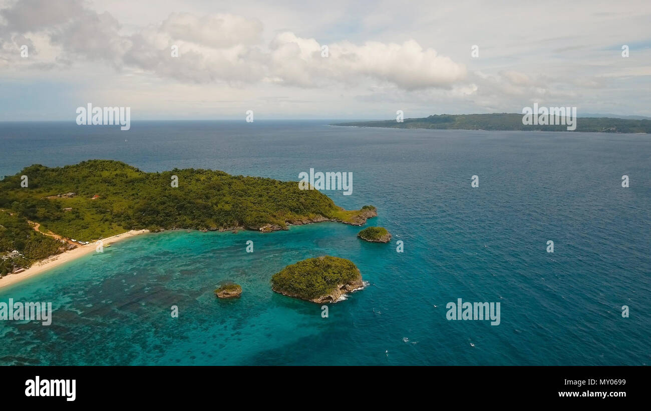 Aerial view of beautiful tropical island with white sand beach, hotels ...