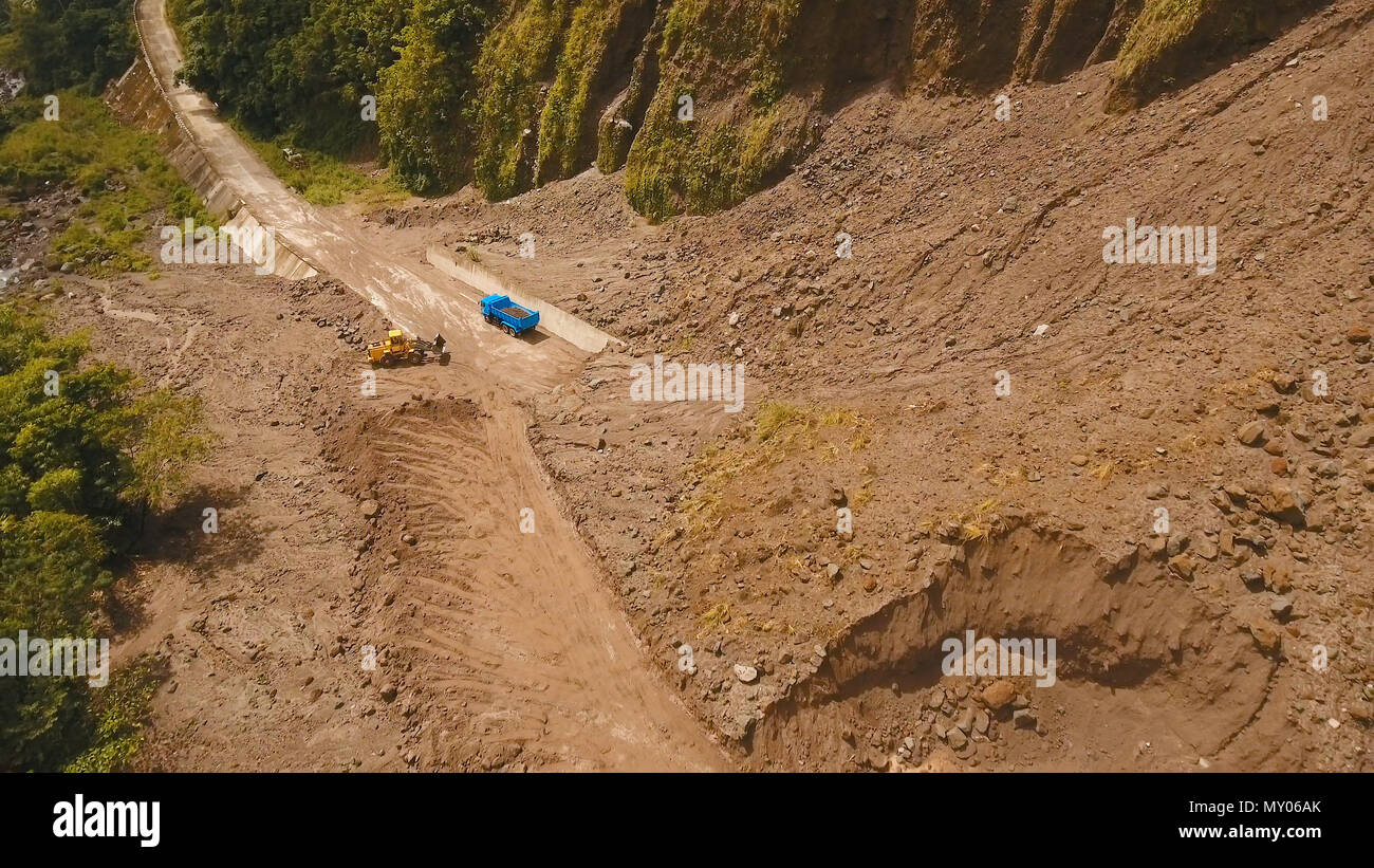 Landslides and rockfalls on the road in the mountains, Camiguin. Aerial ...
