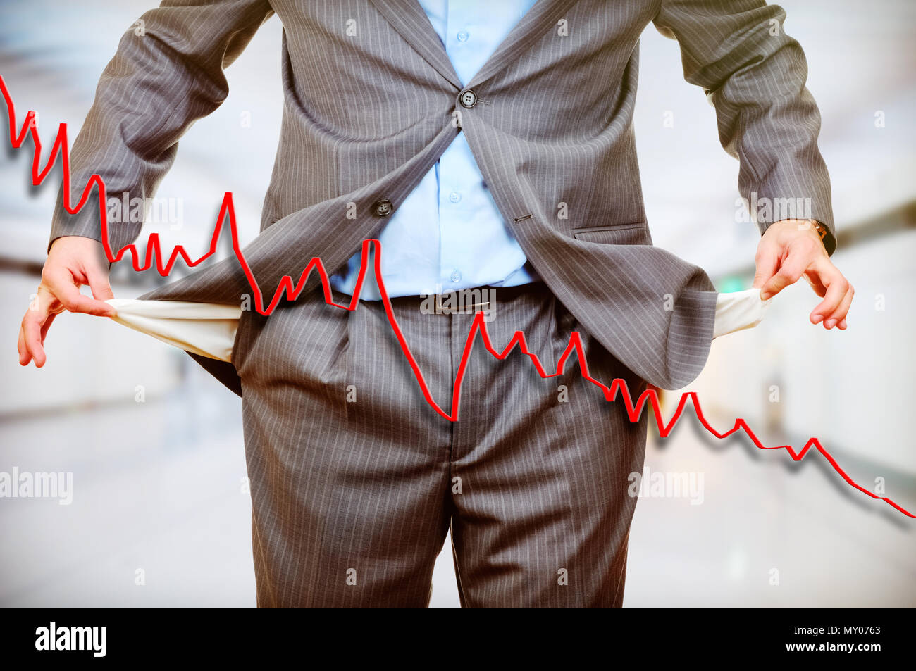 Photo of the man pulling out empty pockets Stock Photo - Alamy