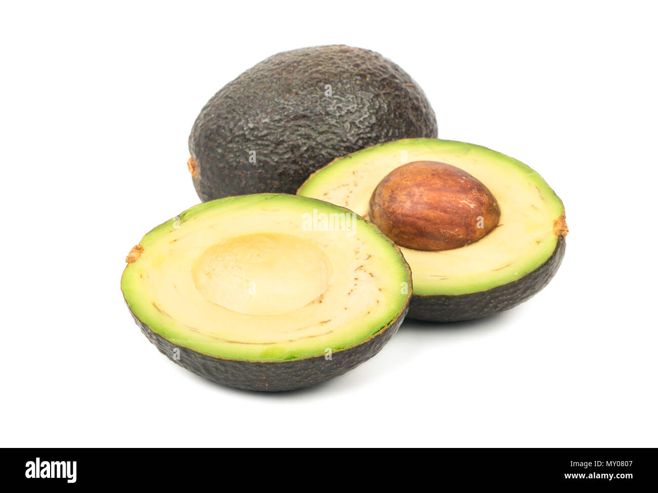 Avocado huss with two halves on a white background Stock Photo - Alamy
