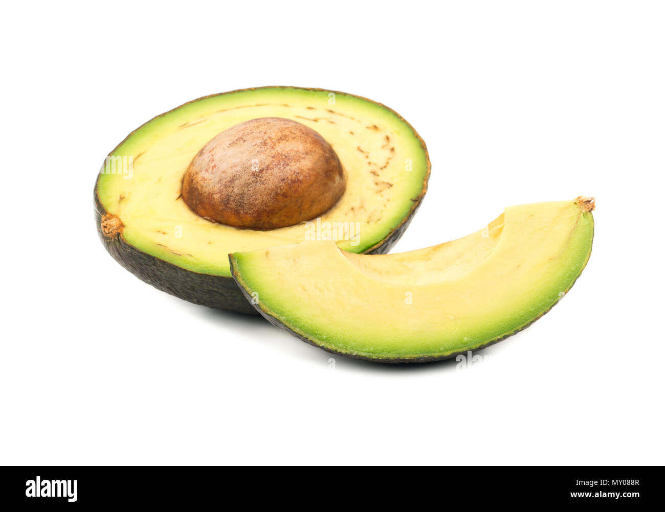 Half an avocado with a slice isolated on white background Stock Photo ...