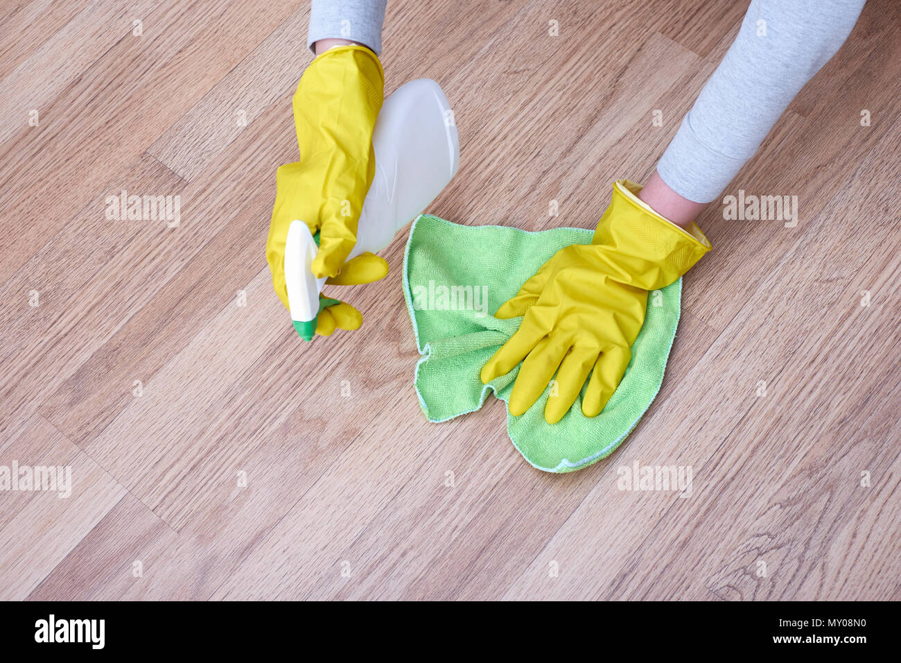 A picture of women hands in yellow gloves cleaning the floor Stock ...