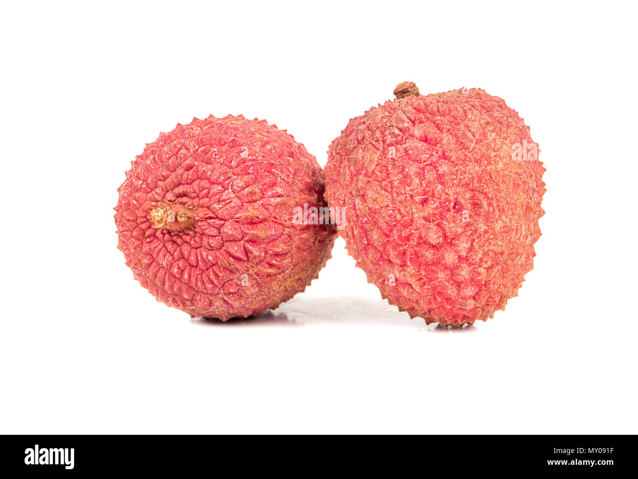 Two lychee fruit isolated on white background Stock Photo - Alamy