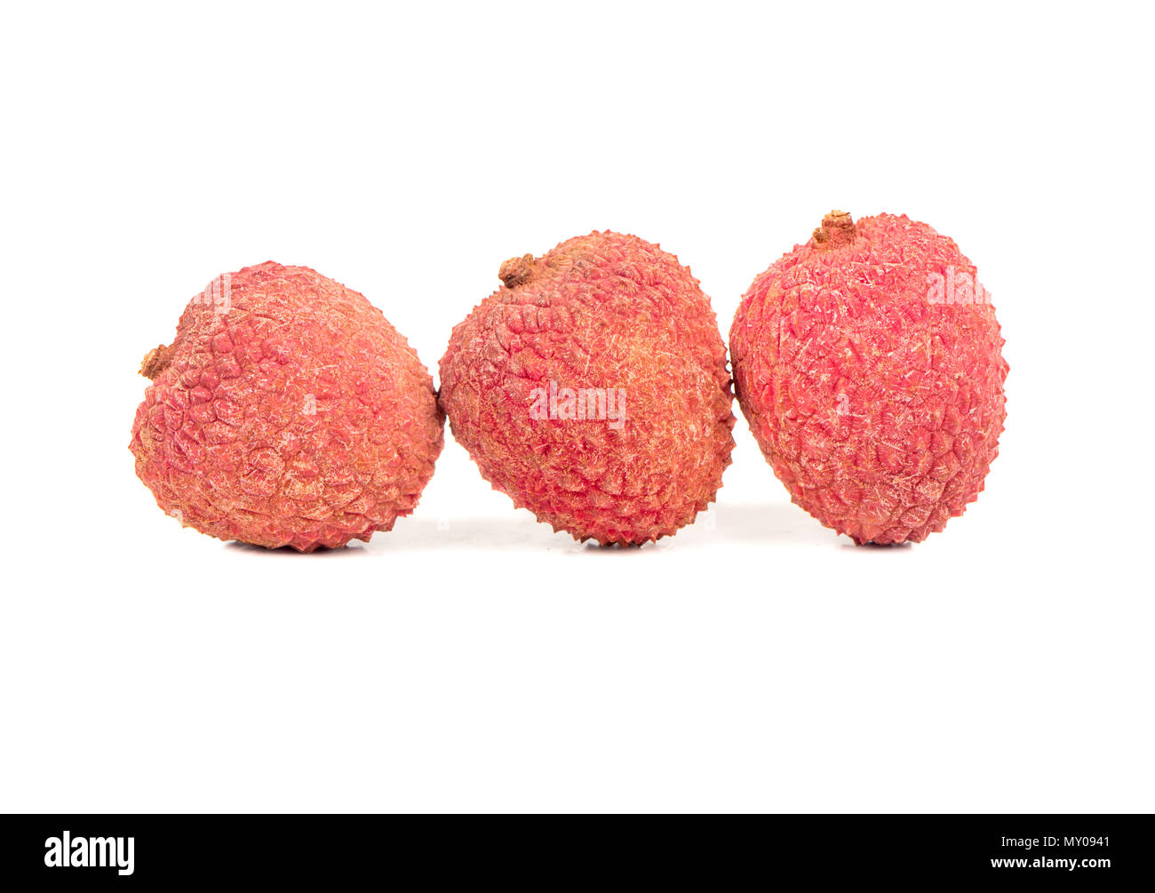 Three fresh lychee fruit in shell on white background Stock Photo - Alamy