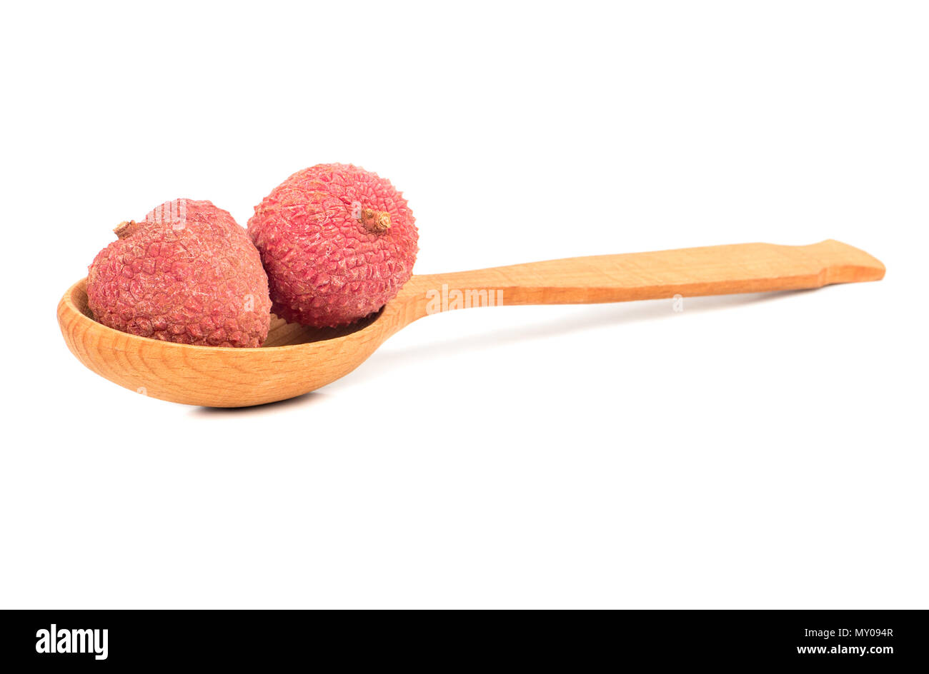 Fresh fruit lychee in the shell in wooden spoon on white background ...