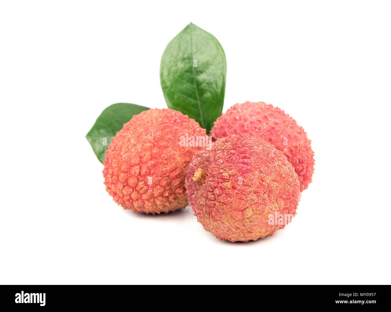 Three lychee fruit in the shell with leaves on white background Stock ...