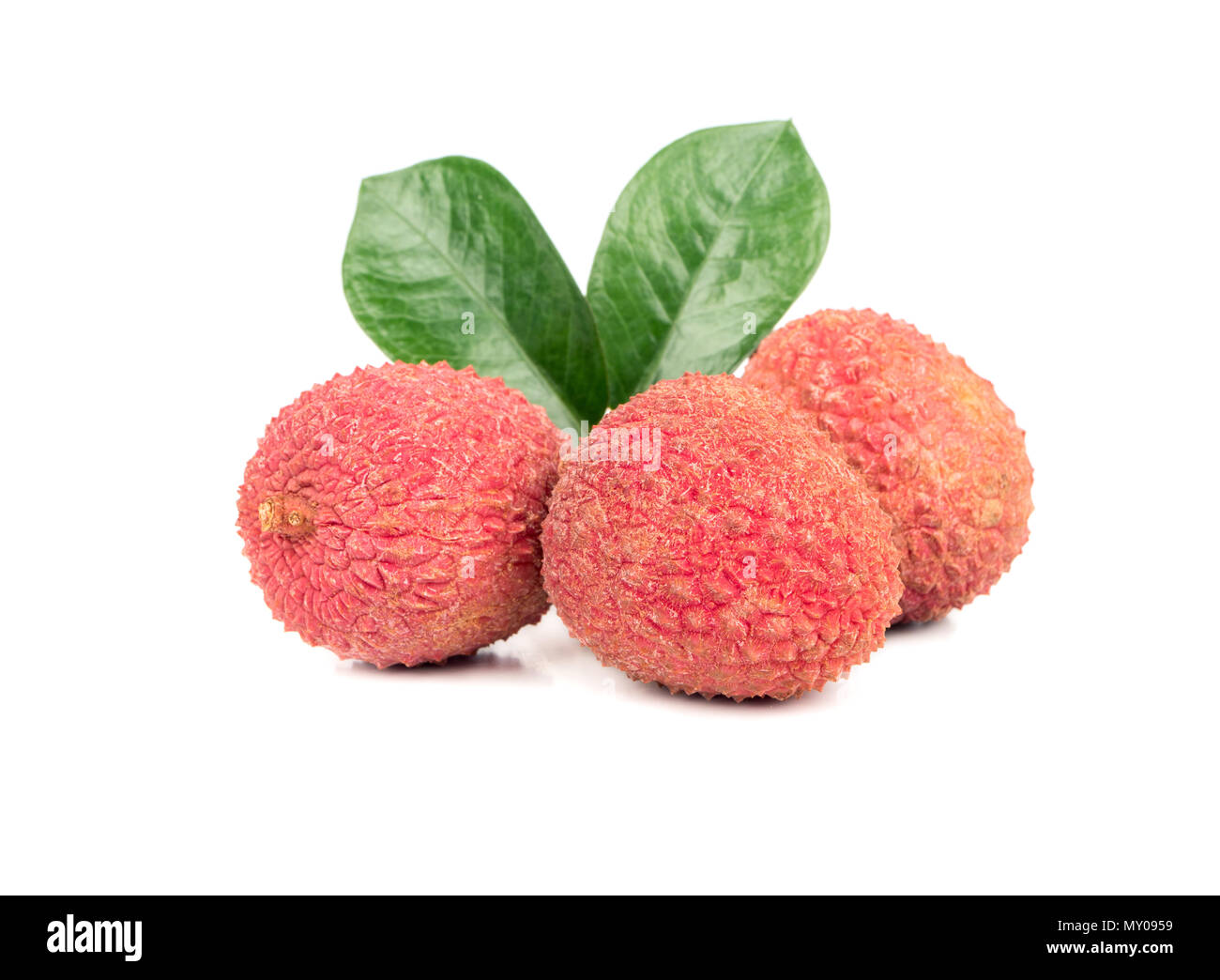 Three lychee fruit in the shell with leaves on white background Stock ...