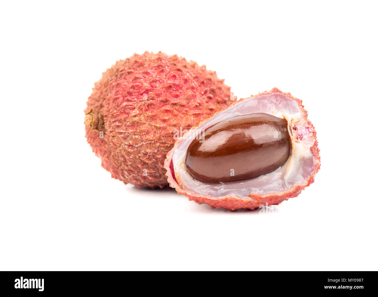 Lychee fruit in the shell with a juicy half on white background Stock ...