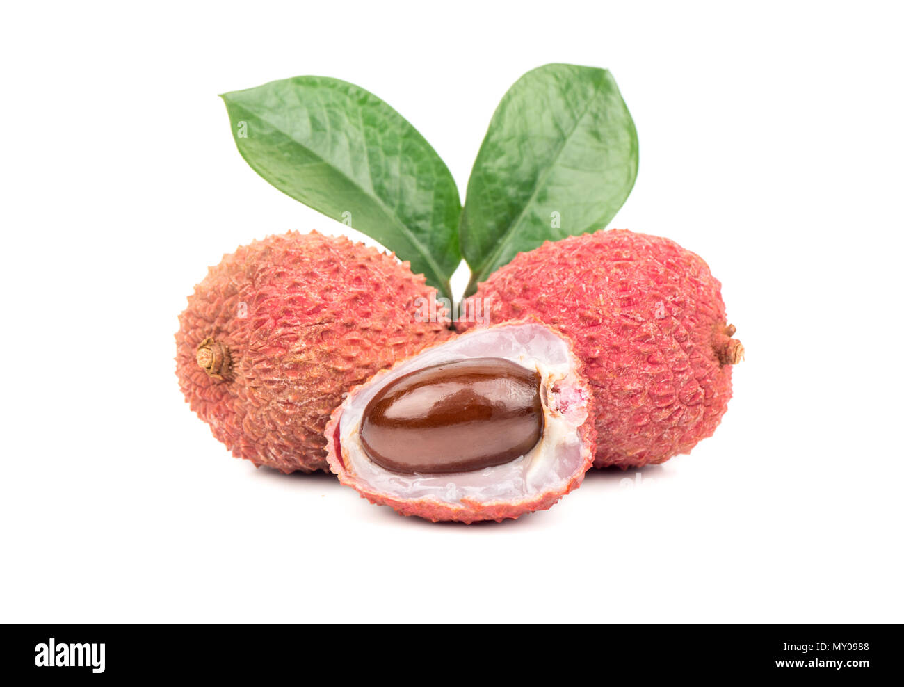 Fresh fruit lychee in the shell with half and leaves on white ...