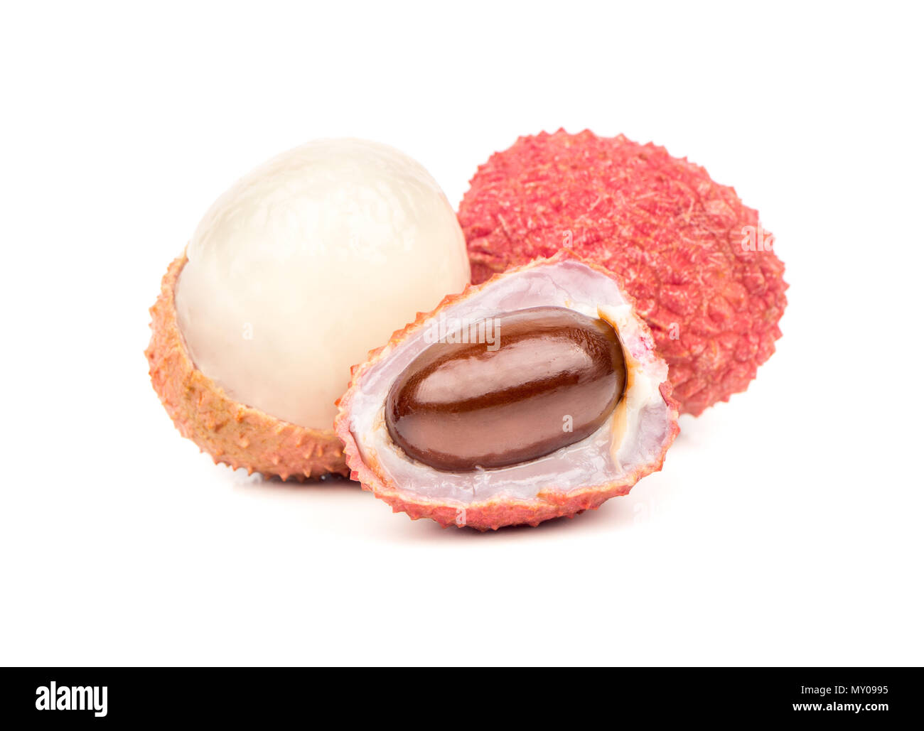 Two lychee fruit in shell half on white background Stock Photo - Alamy