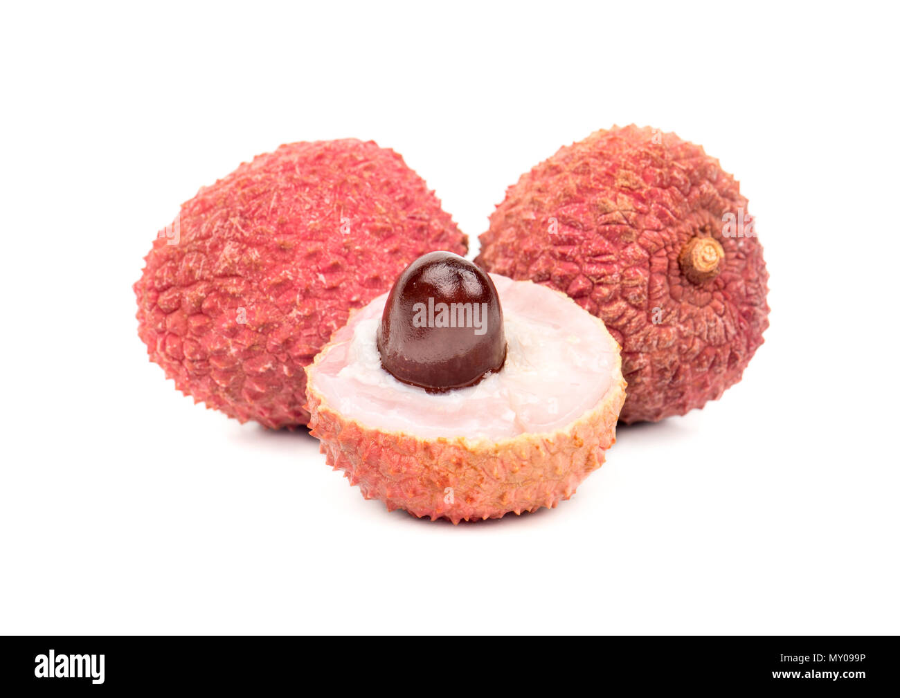 Two lychee fruit in shell half on white background Stock Photo - Alamy