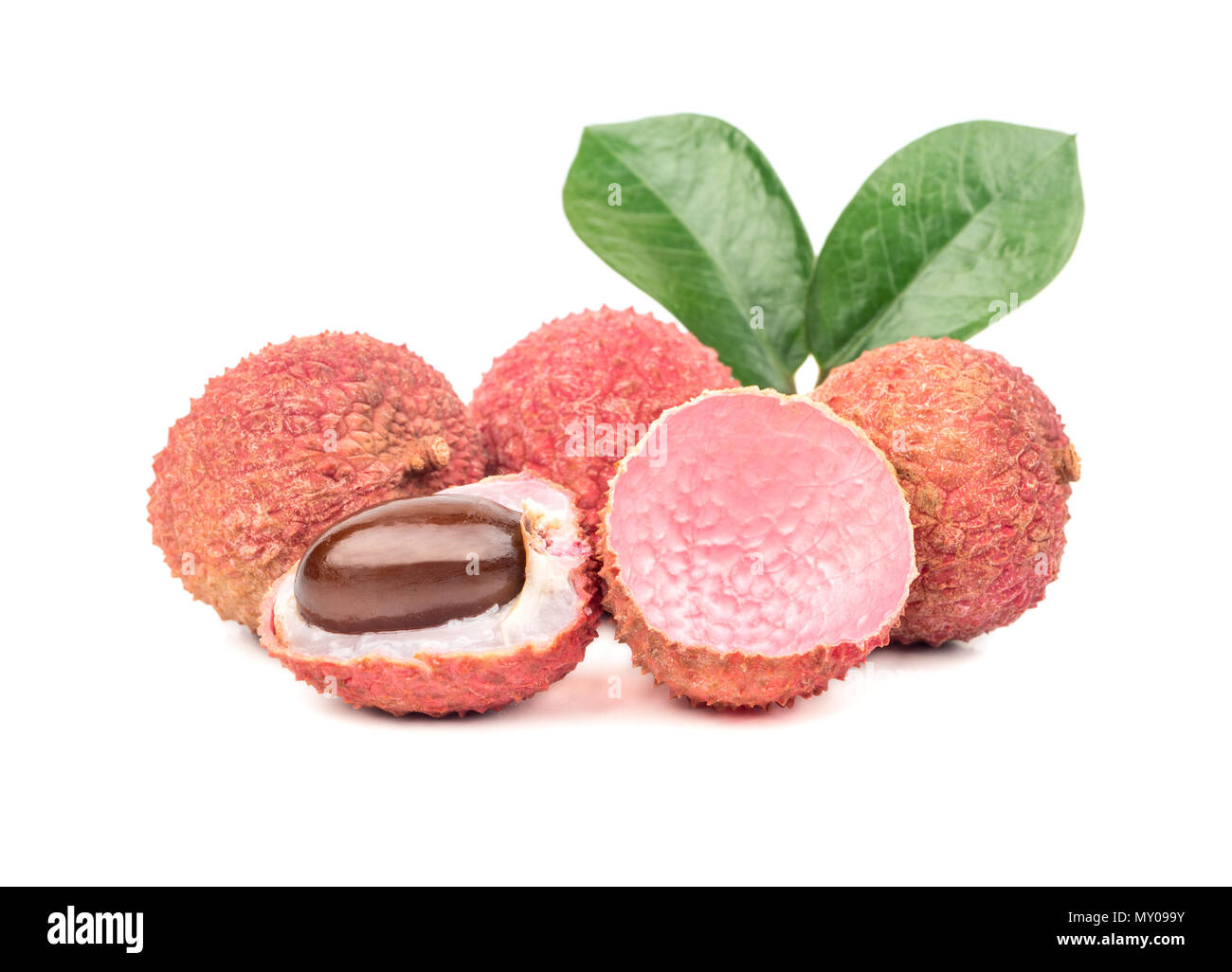 Chinese lychee fruit with two halves and leaves on a white background ...