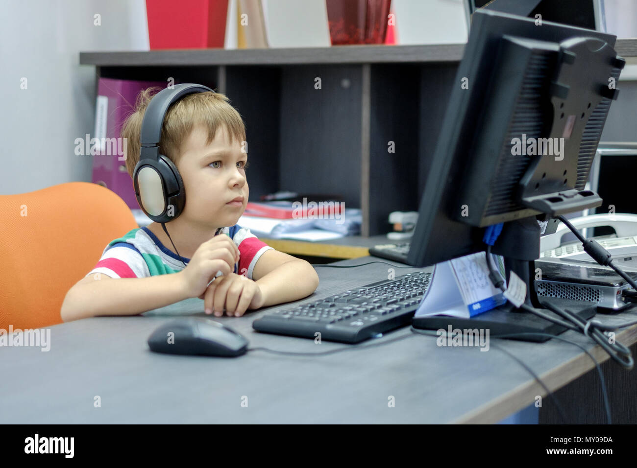 Boy in headphones sitting laptop hi-res stock photography and images ...