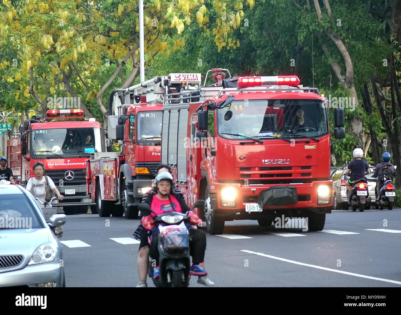 KAOHSIUNG, TAIWAN -- MAY 26, 2018: Three fire truck are on an early ...