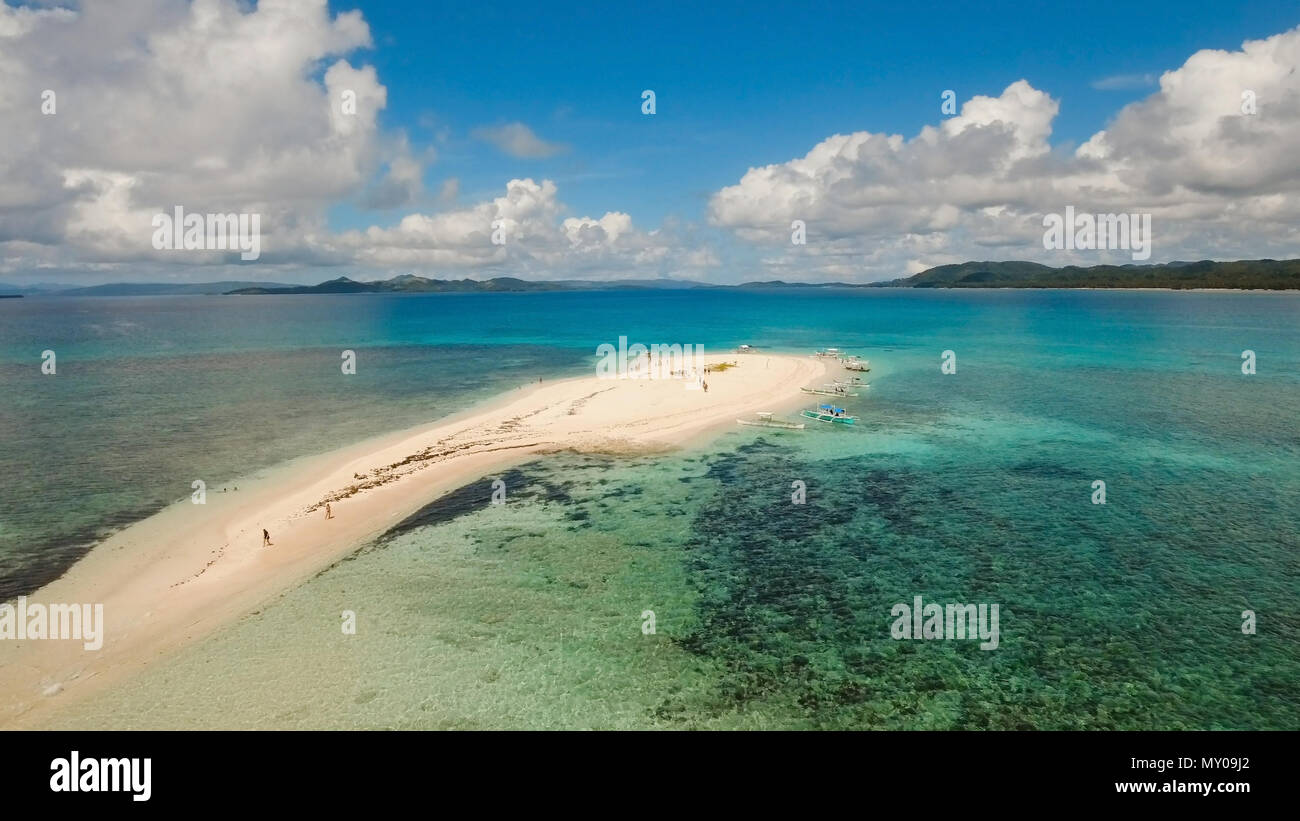 Aerial view of beautiful sand tropical island with white sand beach and ...