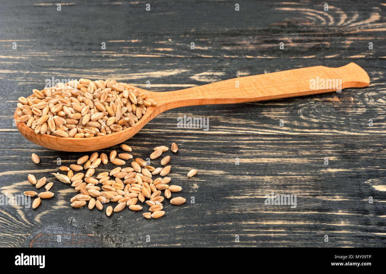 Wooden spoon barley grains hi-res stock photography and images - Alamy