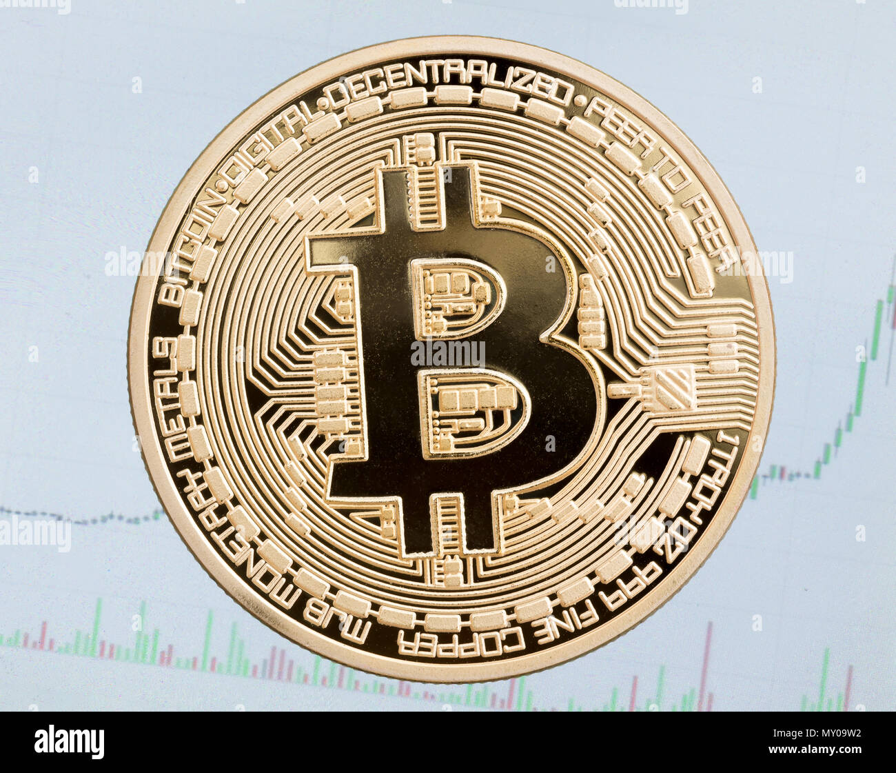 Golden bitcoin on blue background Stock Photo - Alamy