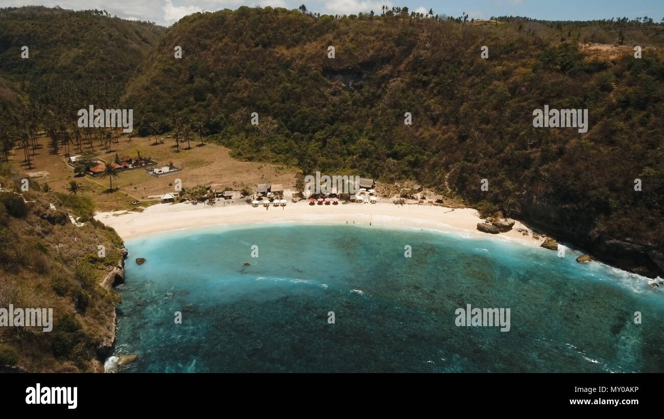 Aerial view of beautiful white sand Atuh beach for relax. Clear blue ...