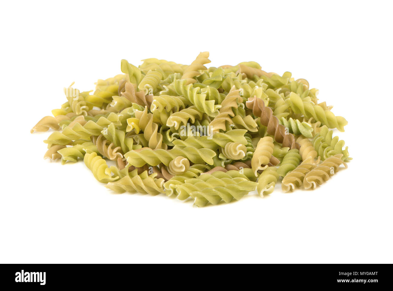Bunch of green raw pasta fusilli on white background Stock Photo - Alamy