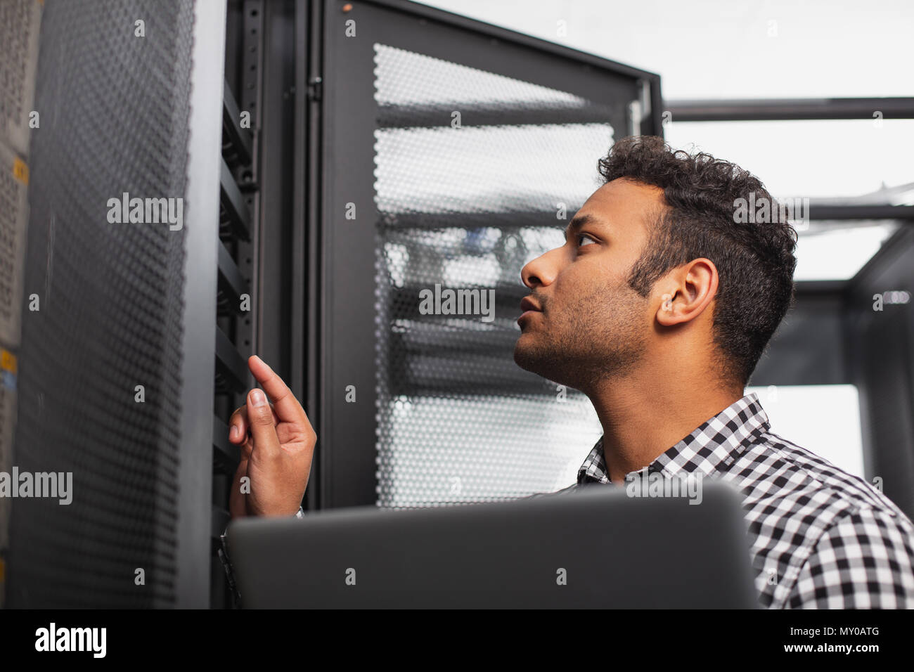 Focused IT guy updating software Stock Photo - Alamy