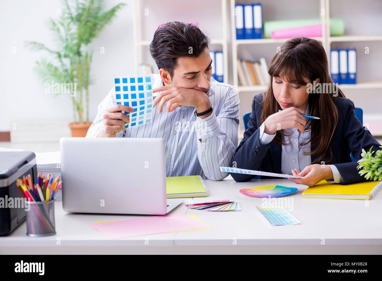 People discussing new design of project Stock Photo - Alamy