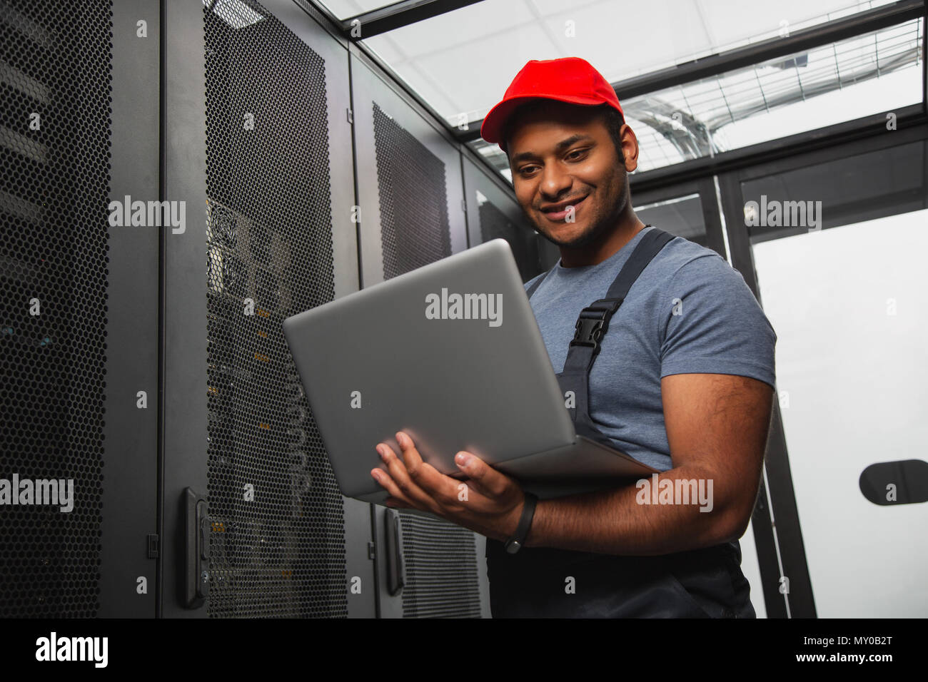 Happy IT engineer installing framework Stock Photo - Alamy