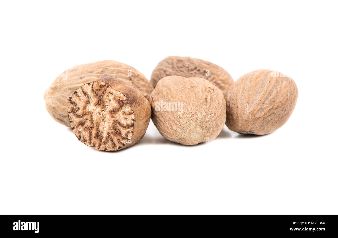 Dry nutmeg with half isolated on white background Stock Photo - Alamy
