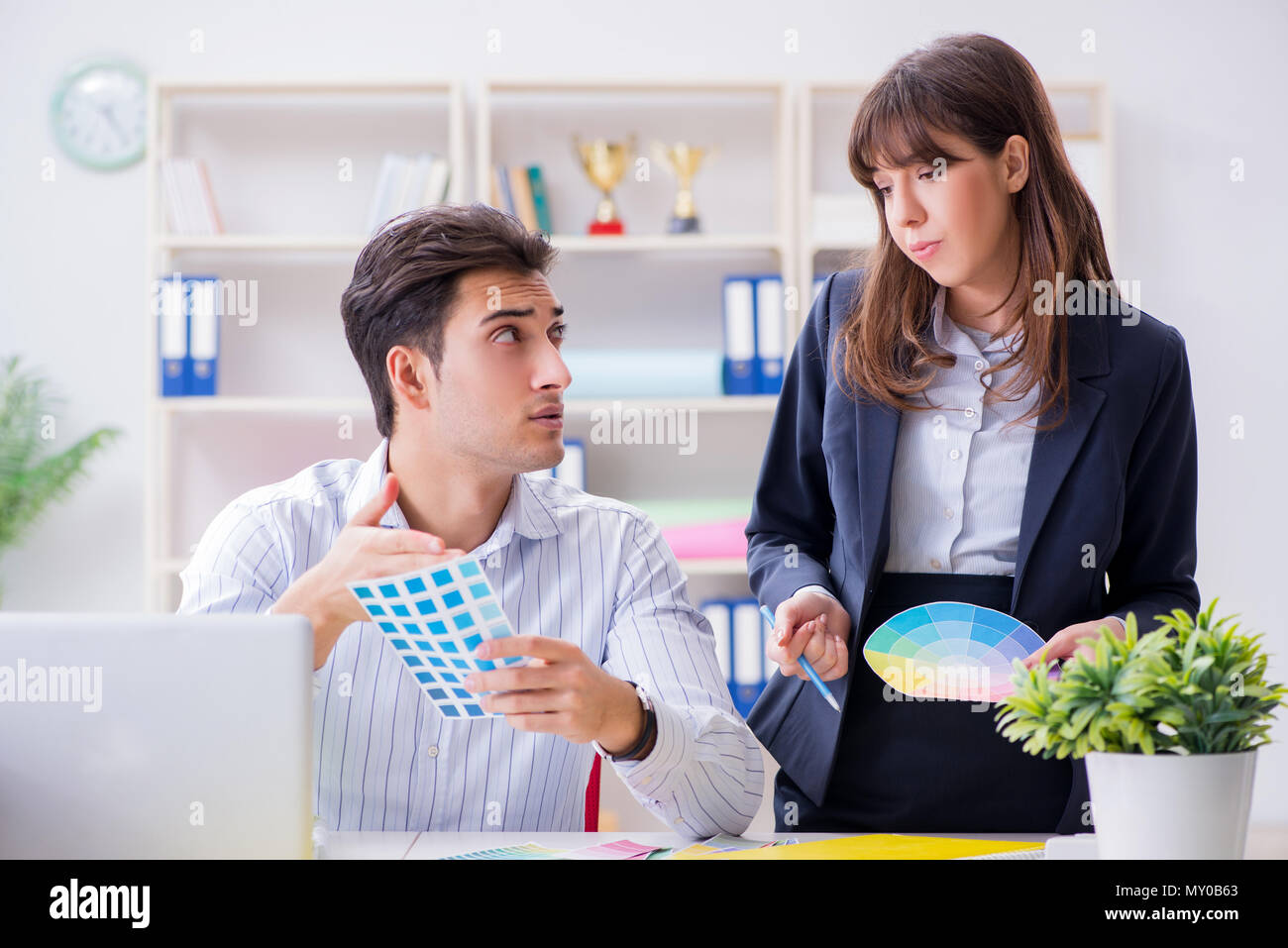 People discussing new design of project Stock Photo - Alamy