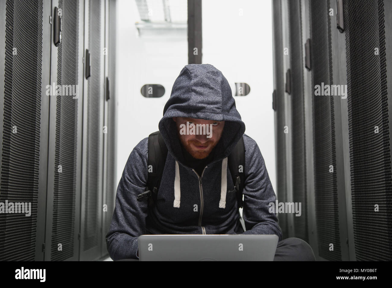 Angry male hacker breaking into system Stock Photo - Alamy