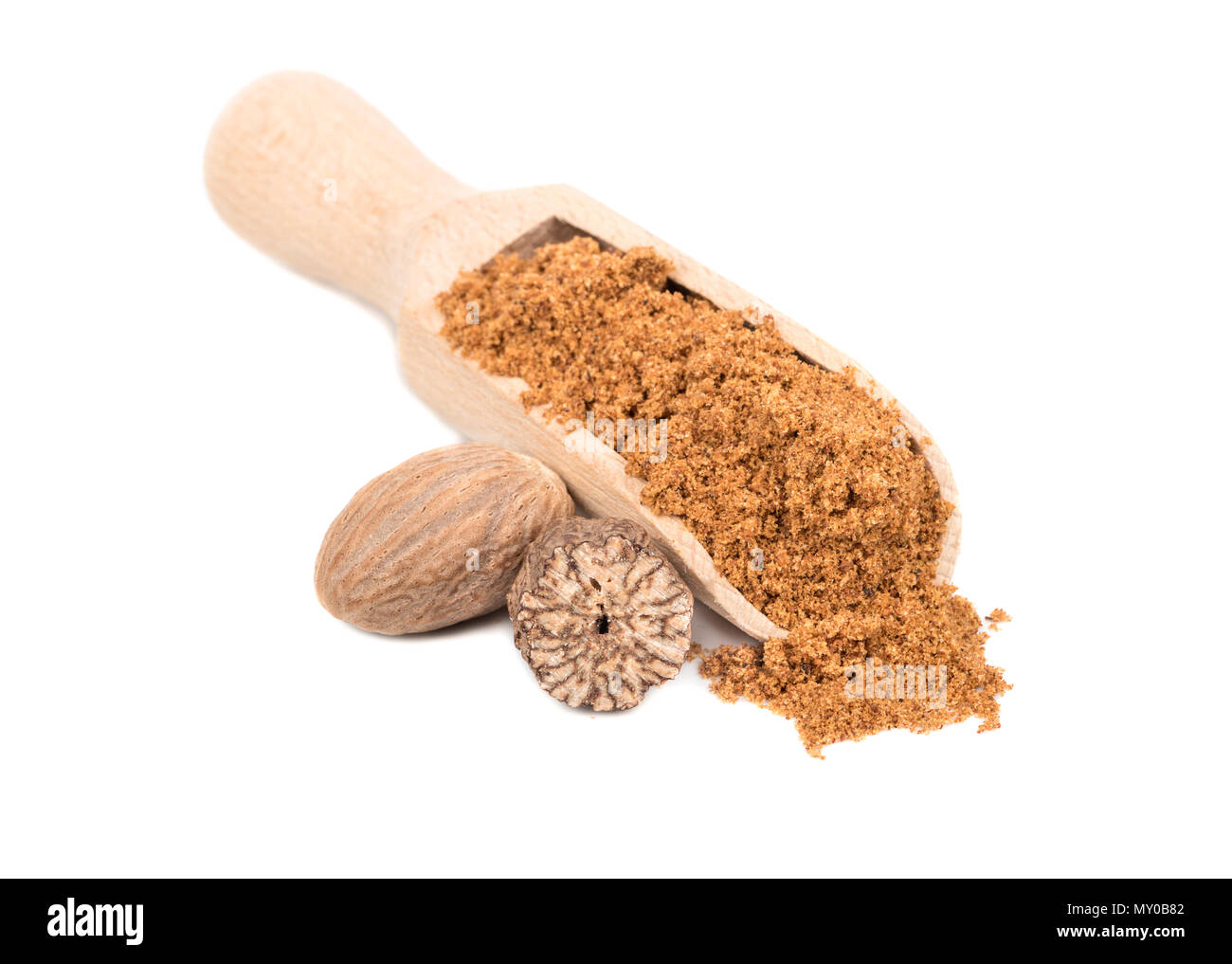 Spice nutmeg powder in scoop on white background Stock Photo - Alamy