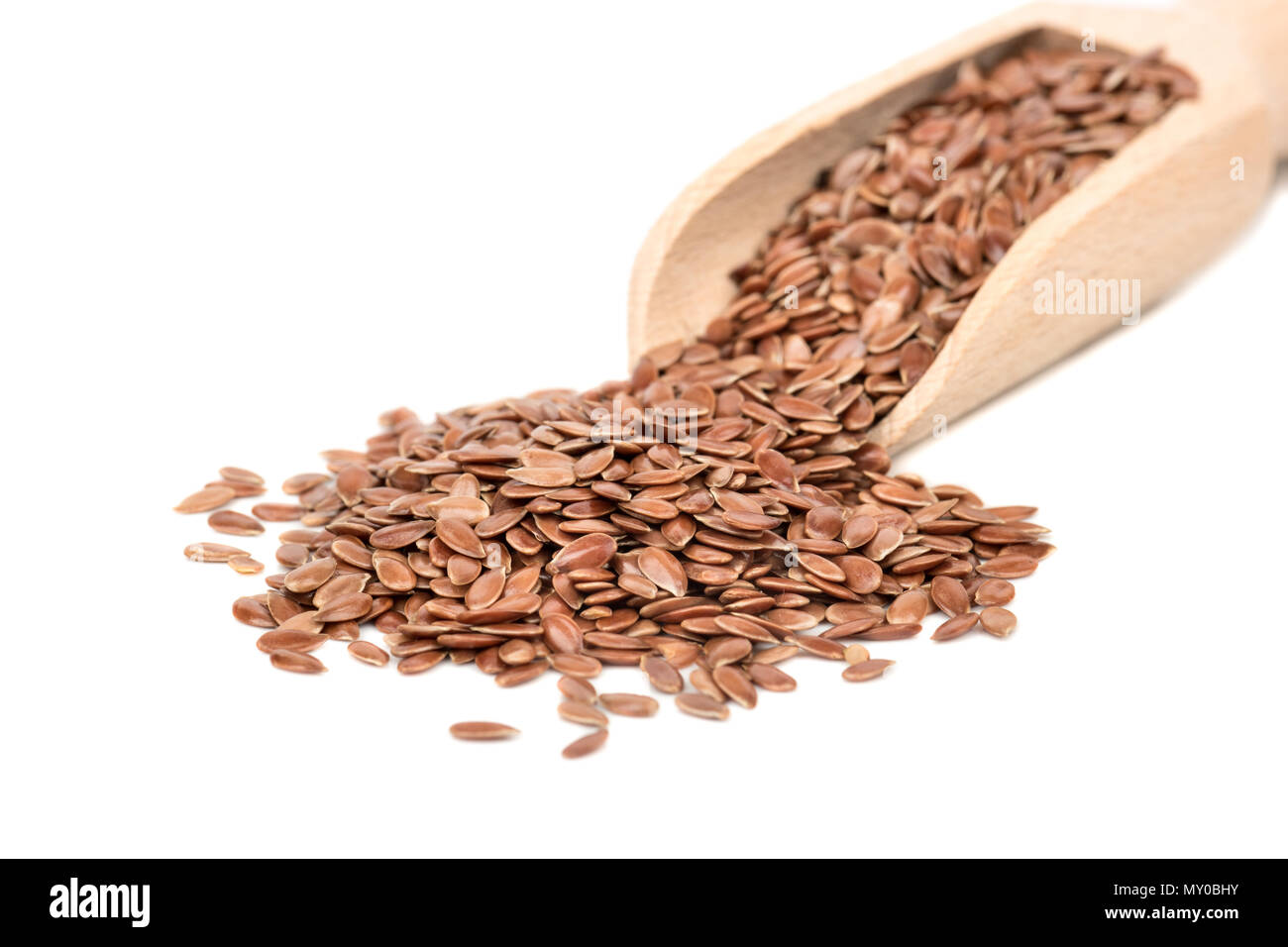 Flax seed in wooden scoop on white background Stock Photo - Alamy