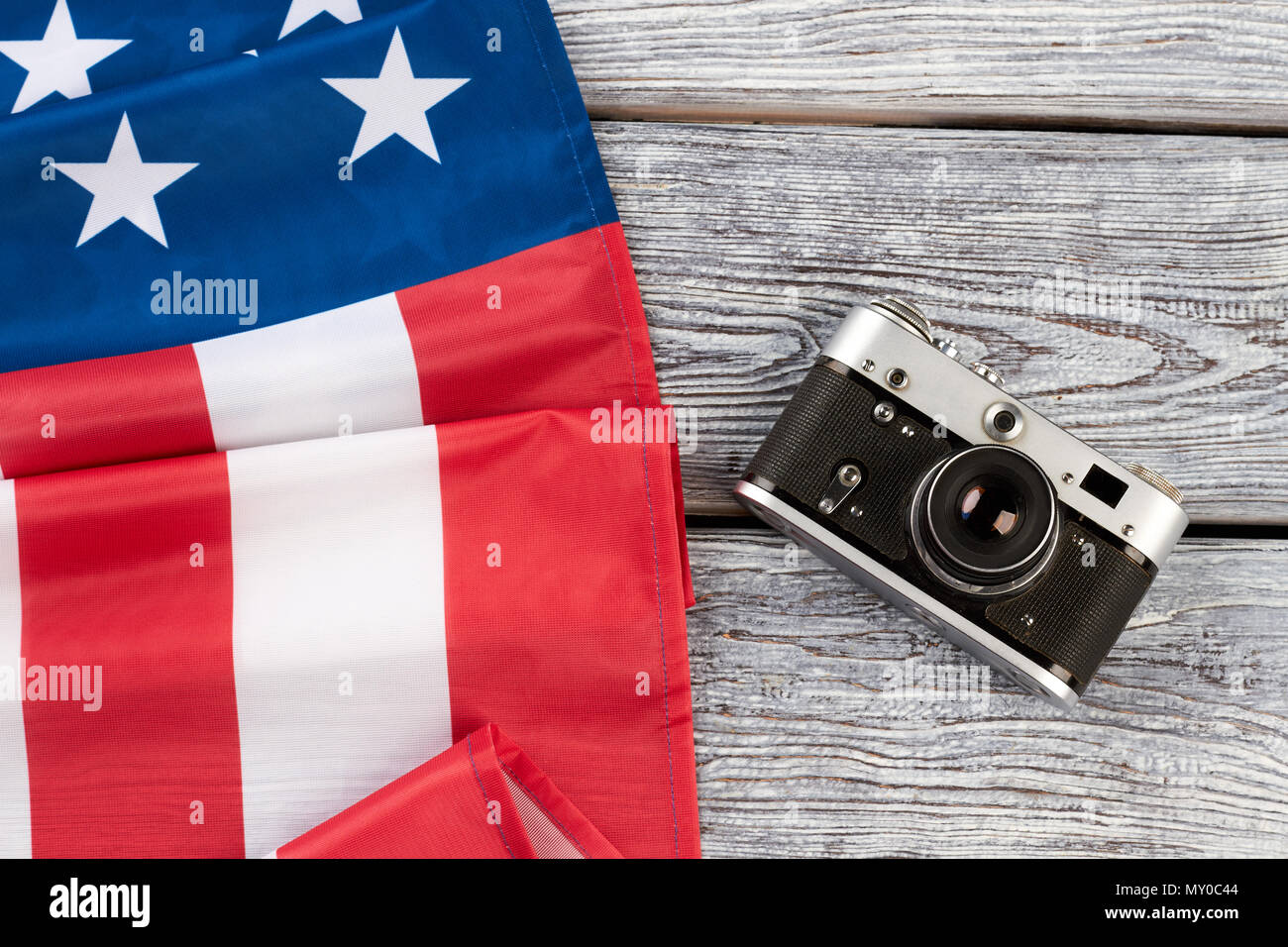 Folded american flag and film camera. USA national flag and old ...