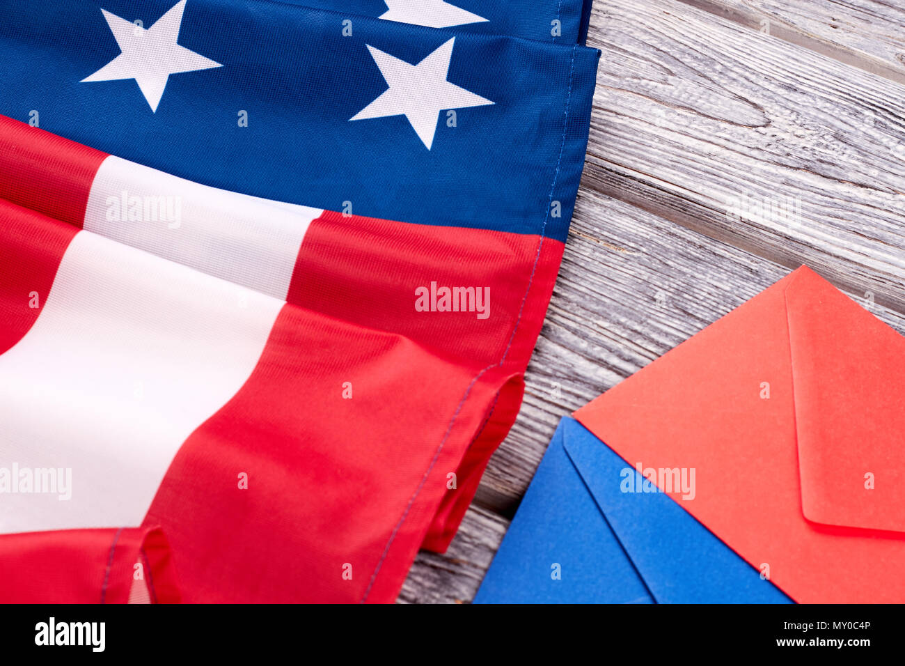 Close up American flag and envelopes. USA national flag and two ...