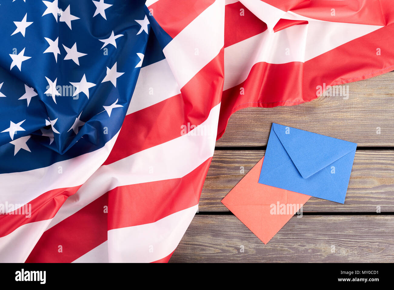 USA flag, red and blue envelopes. Crumpled American flag and colorful ...