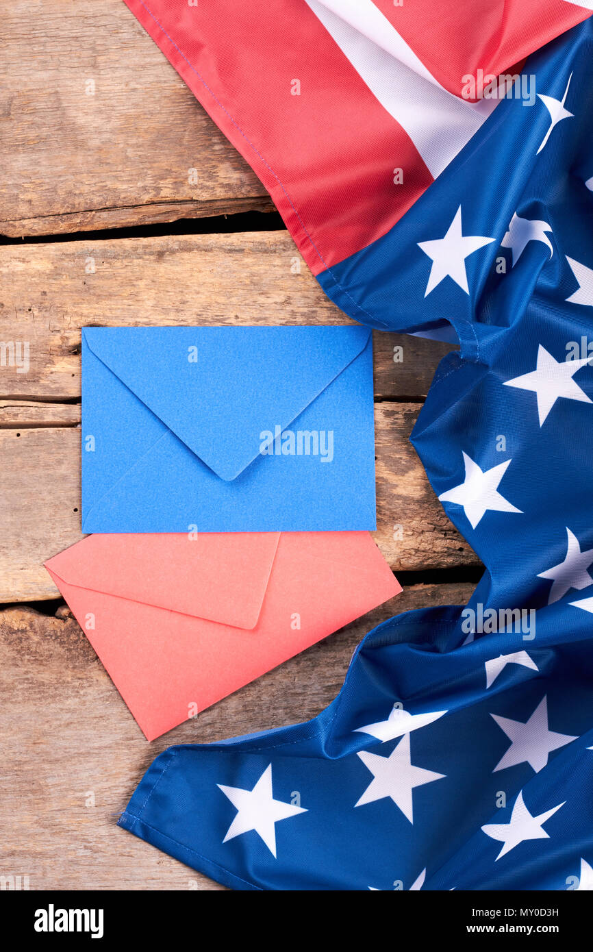 USA flag and colorful envelopes. Crumpled flag of America and two ...