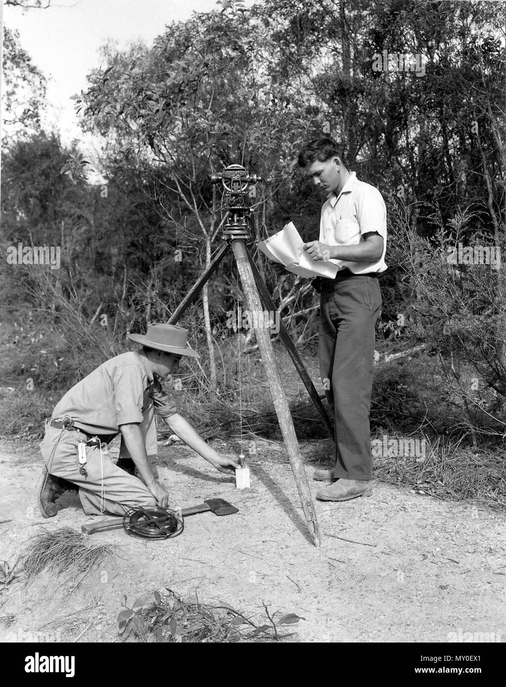 Surveyors in the field using theodolite - Queensland, c July Stock ...