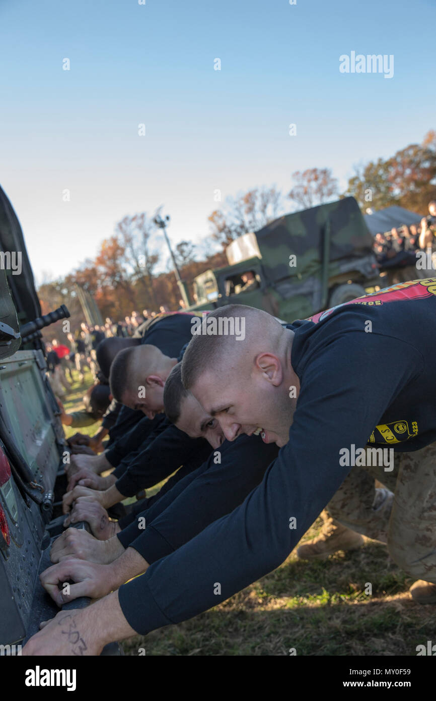 U.S. Marines with the Officer Candidate School (OCS) push a truck ...