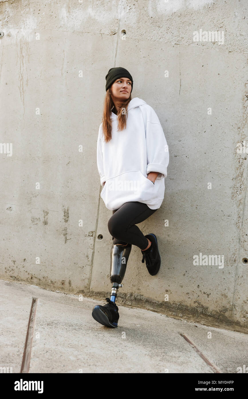 Photo of caucasian disabled girl with bionic leg in casual wear ...