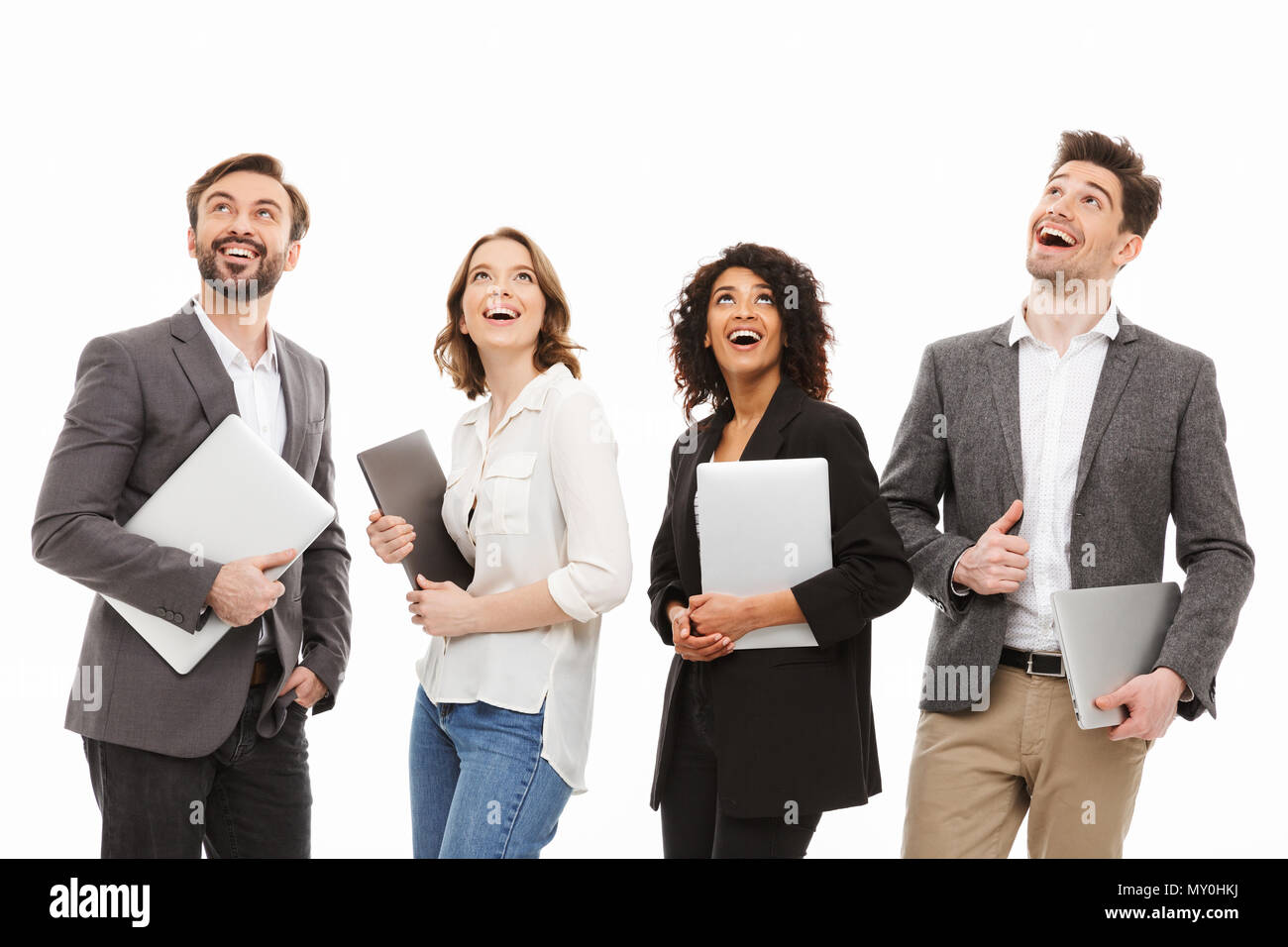 Portrait of a group of happy multiracial business people holding laptop ...