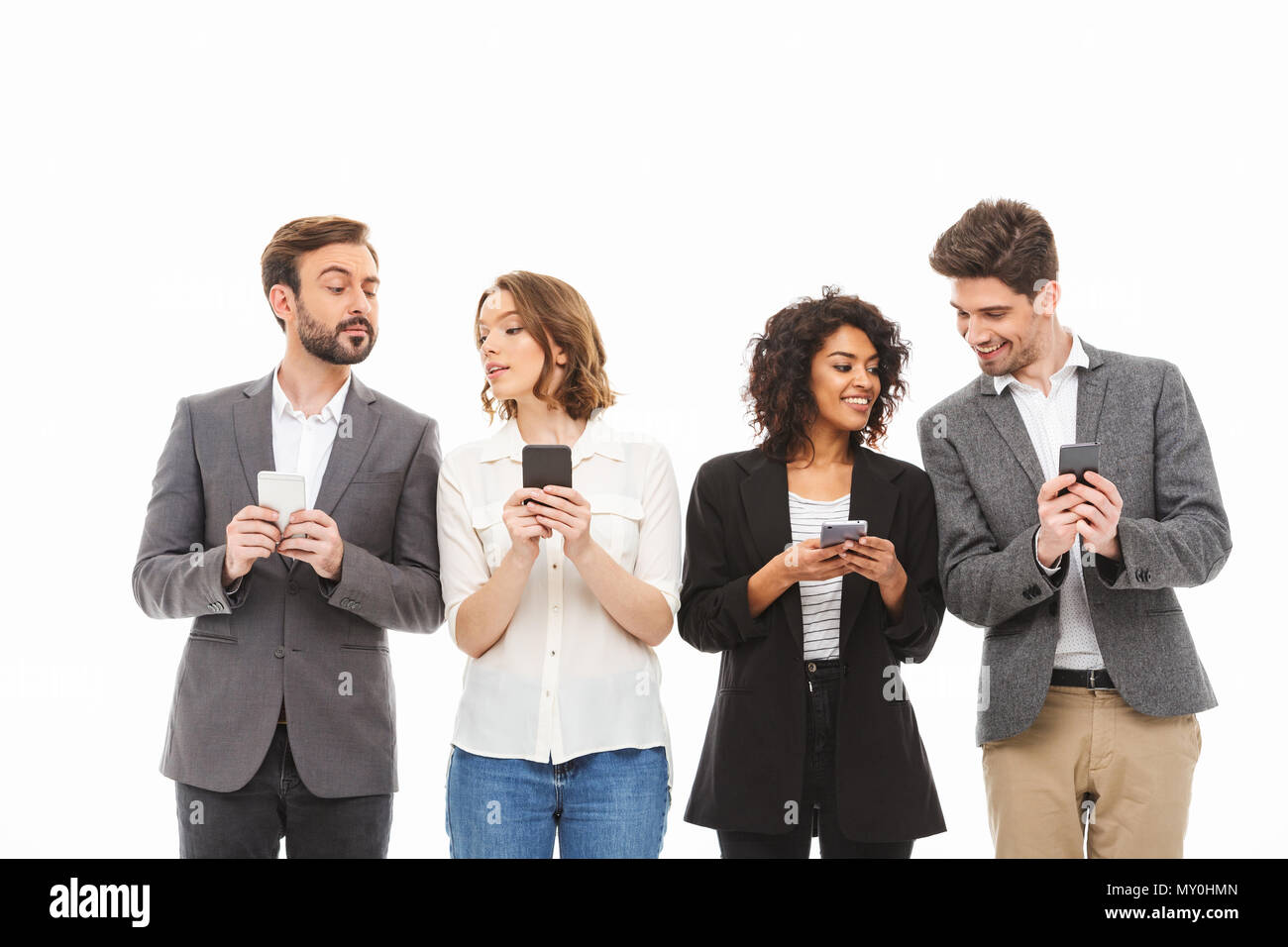 Group of confident young business people using mobile phones isolated ...