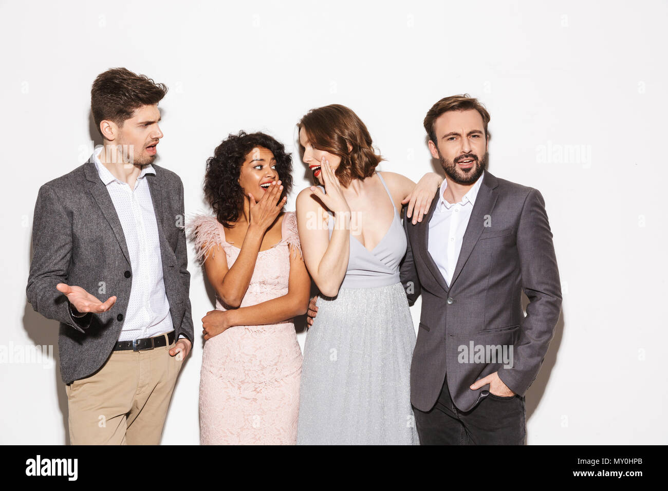 Group of well dressed multiracial people standing together and talking ...