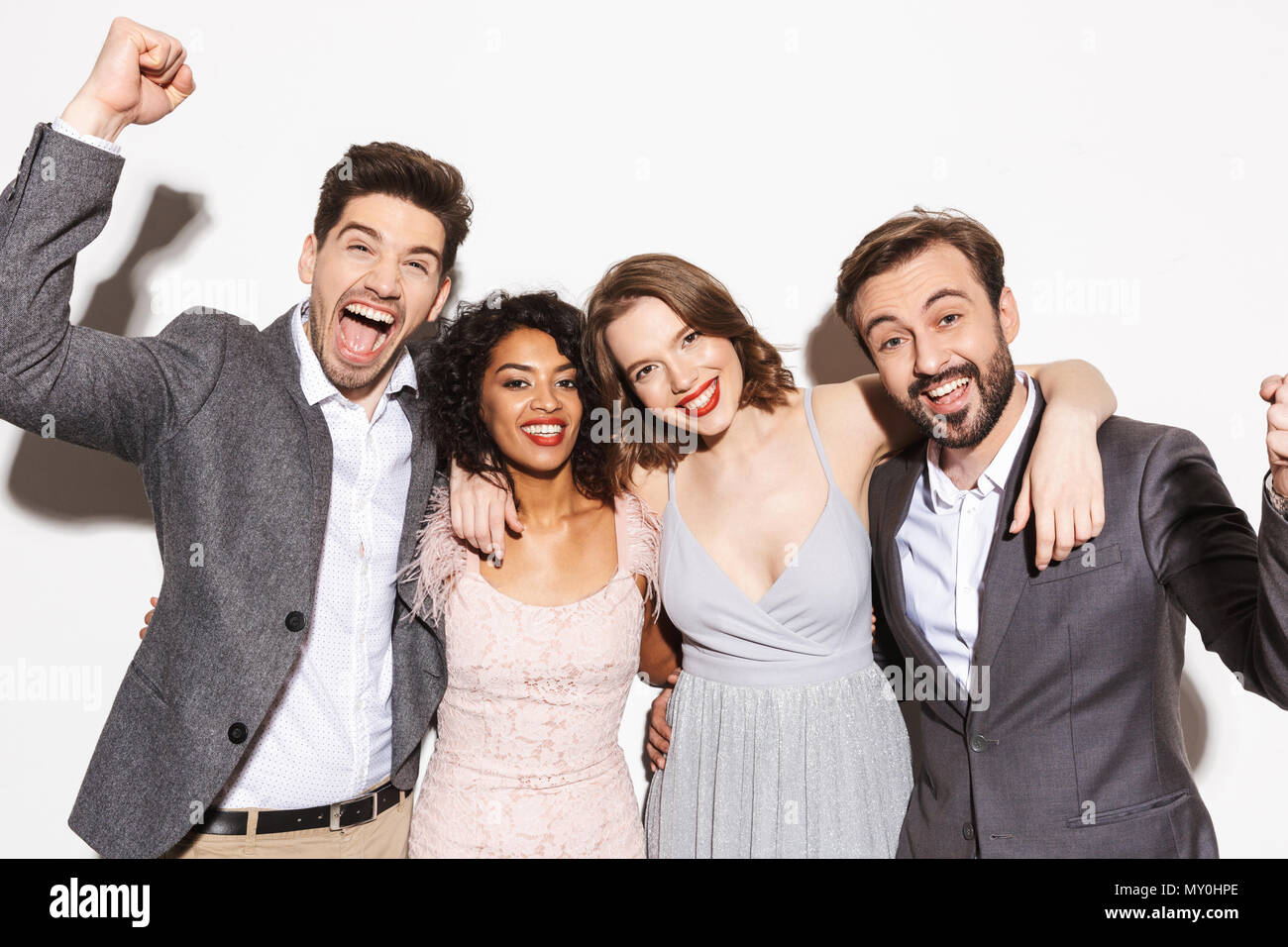 Group of happy well dressed multiracial people celebrating together ...